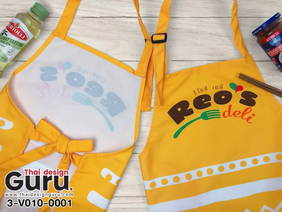 รับผลิตผ้ากันเปื้อนแม่ครัว สีเหลือง ผ้าแคนวาส สกรีนลาย แบรนด์ Reo's